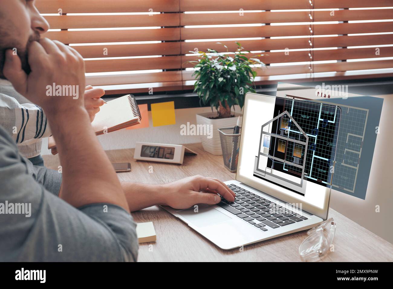 Engineers at work. Colleagues projecting house in office Stock Photo ...