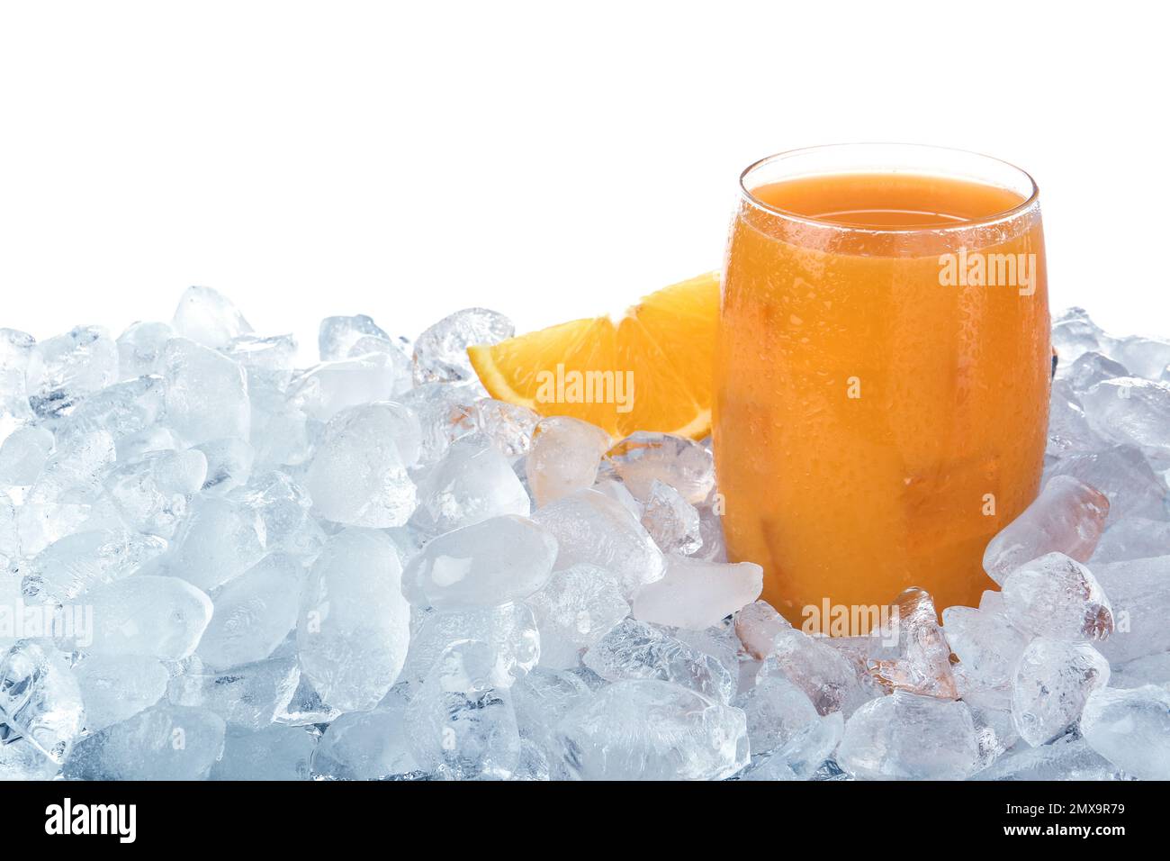 Ice cubes and orange juice on white background Stock Photo - Alamy
