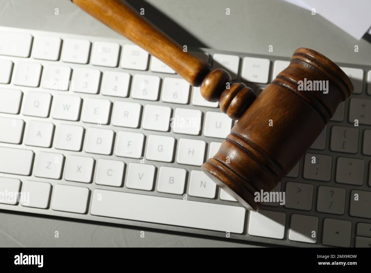 Gavel and computer keyboard on grey table, top view. Cyber crime Stock ...