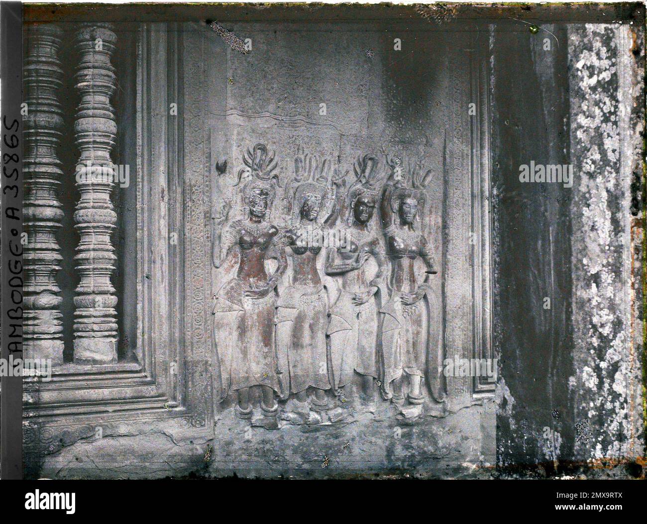 Angkor, Cambodia, Indochina a relief of Apsaras carved near a balusters ...