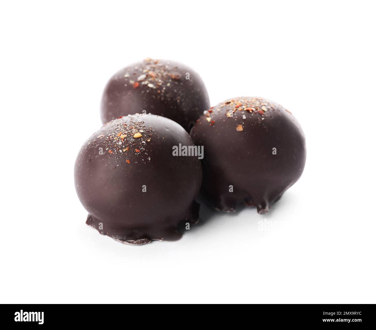 Delicious dark chocolate candies isolated on white Stock Photo - Alamy