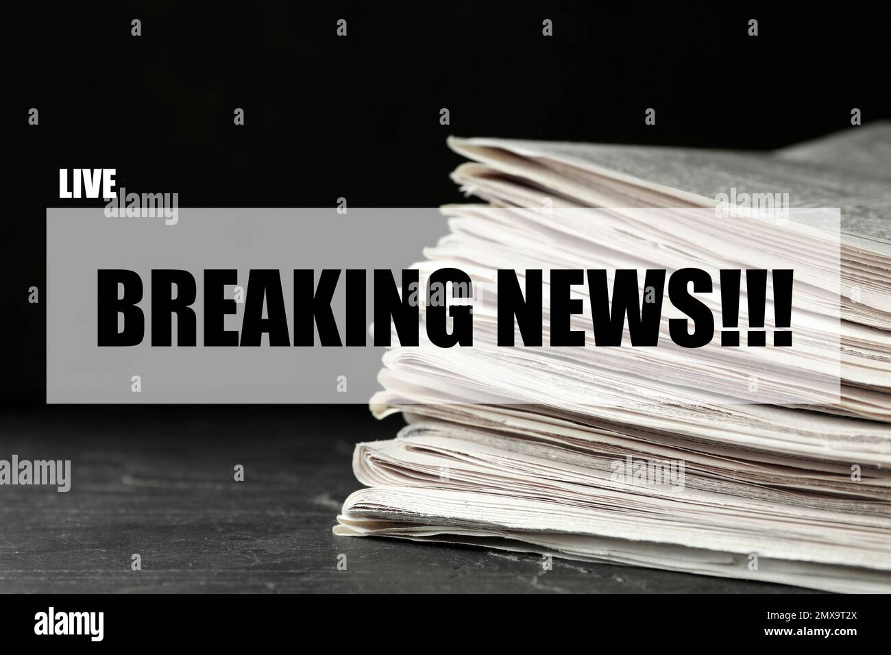 Phrase Breaking News and stack of newspapers on table. Journalist's ...