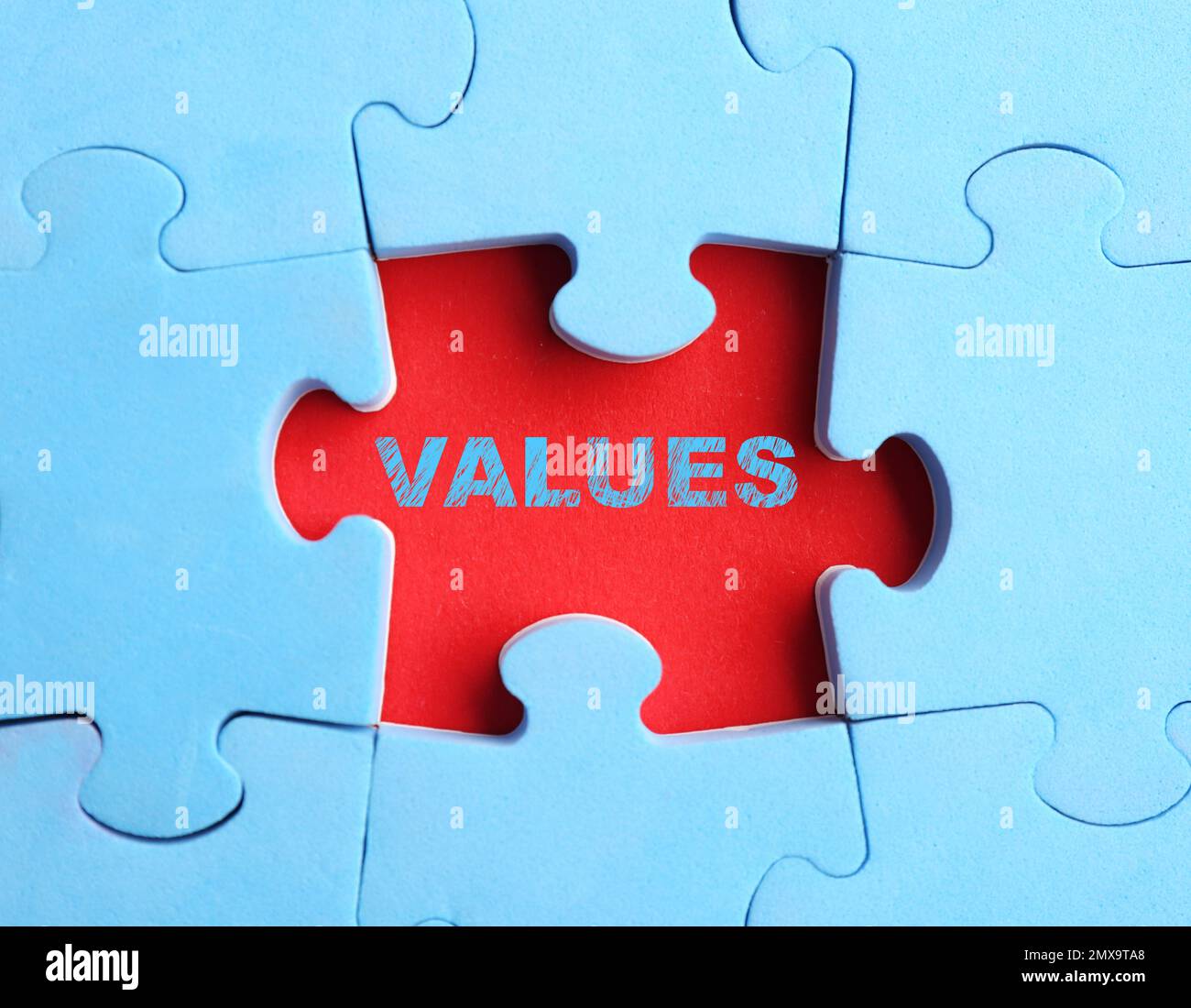 Core values concept. Light blue puzzle with missing piece on red ...
