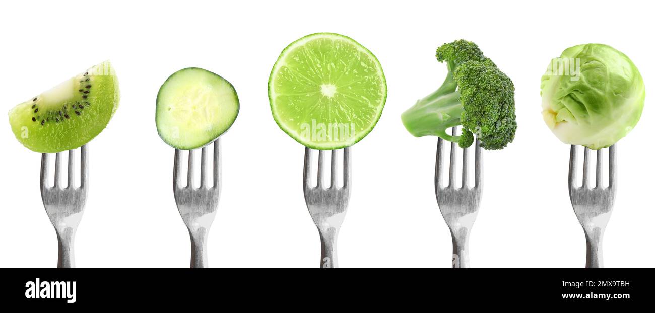 Forks with different vegetables and fruits on white background, banner ...