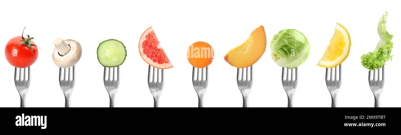 Forks with different vegetables and fruits on white background, banner ...