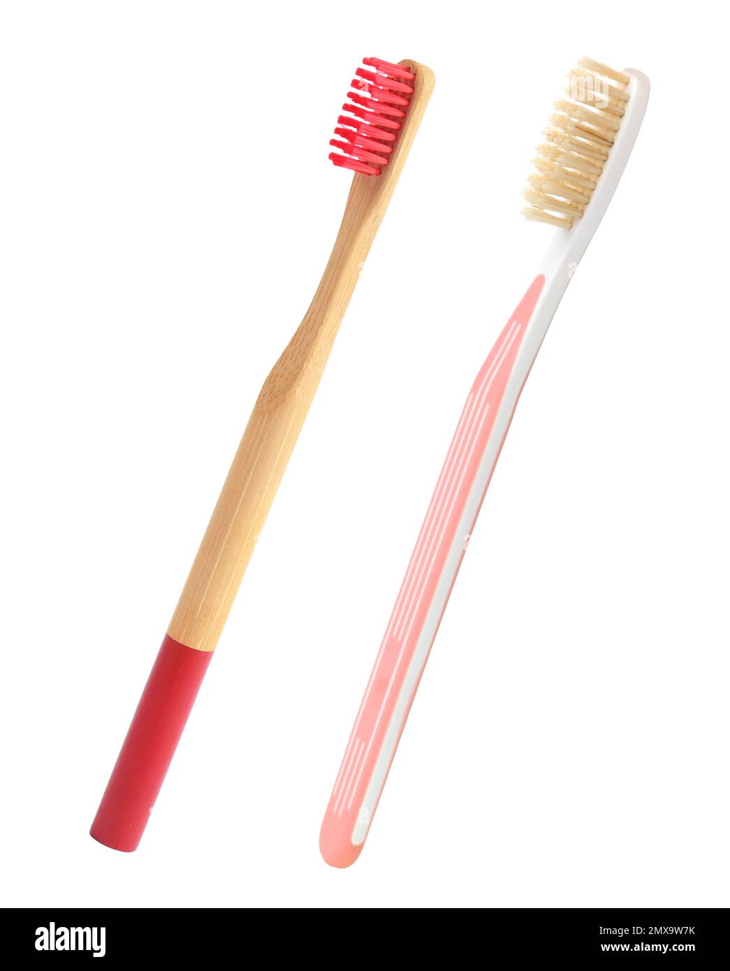 Different natural toothbrushes on white background Stock Photo - Alamy