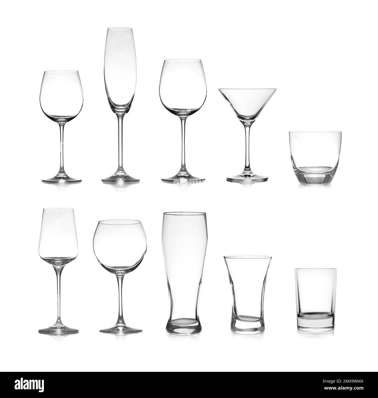 Set of different empty glasses on white background Stock Photo - Alamy