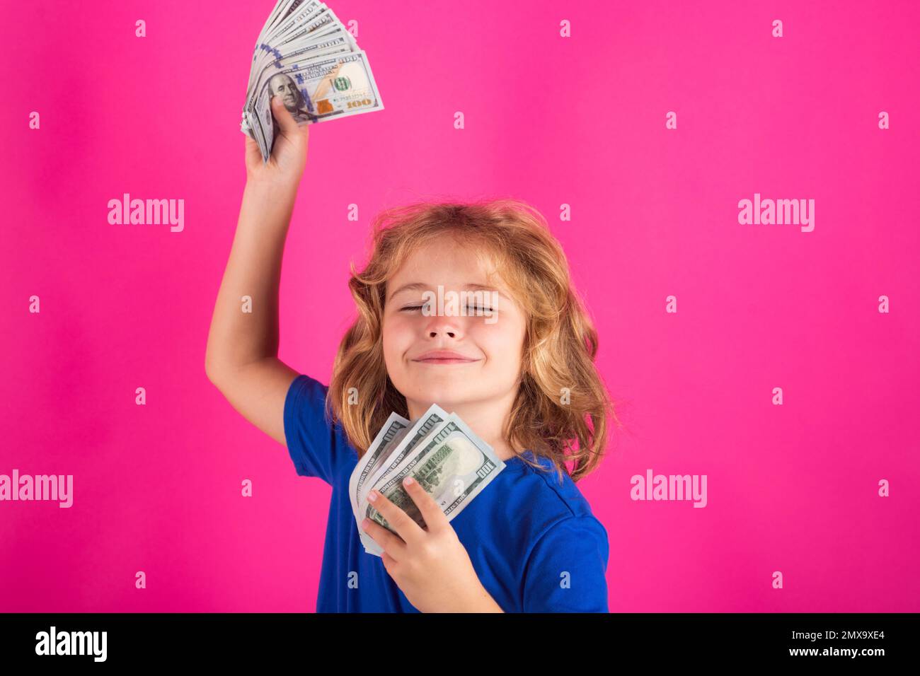 Happy funny rich kid boy with money dollars cash Stock Photo - Alamy