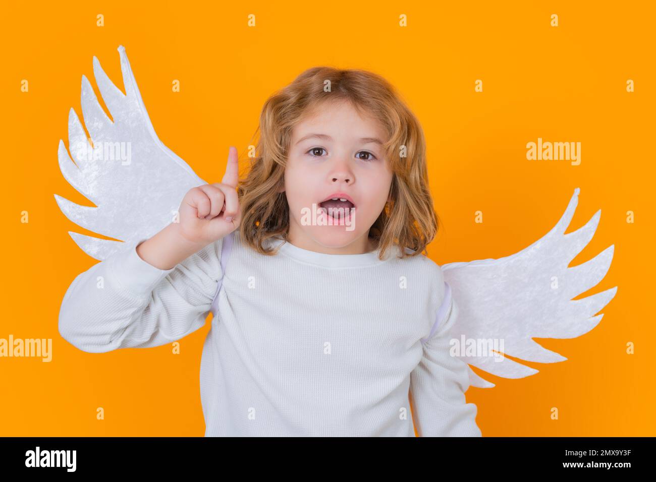 Child angel pointing up, point gesture, idea. Valentine angel. Little ...