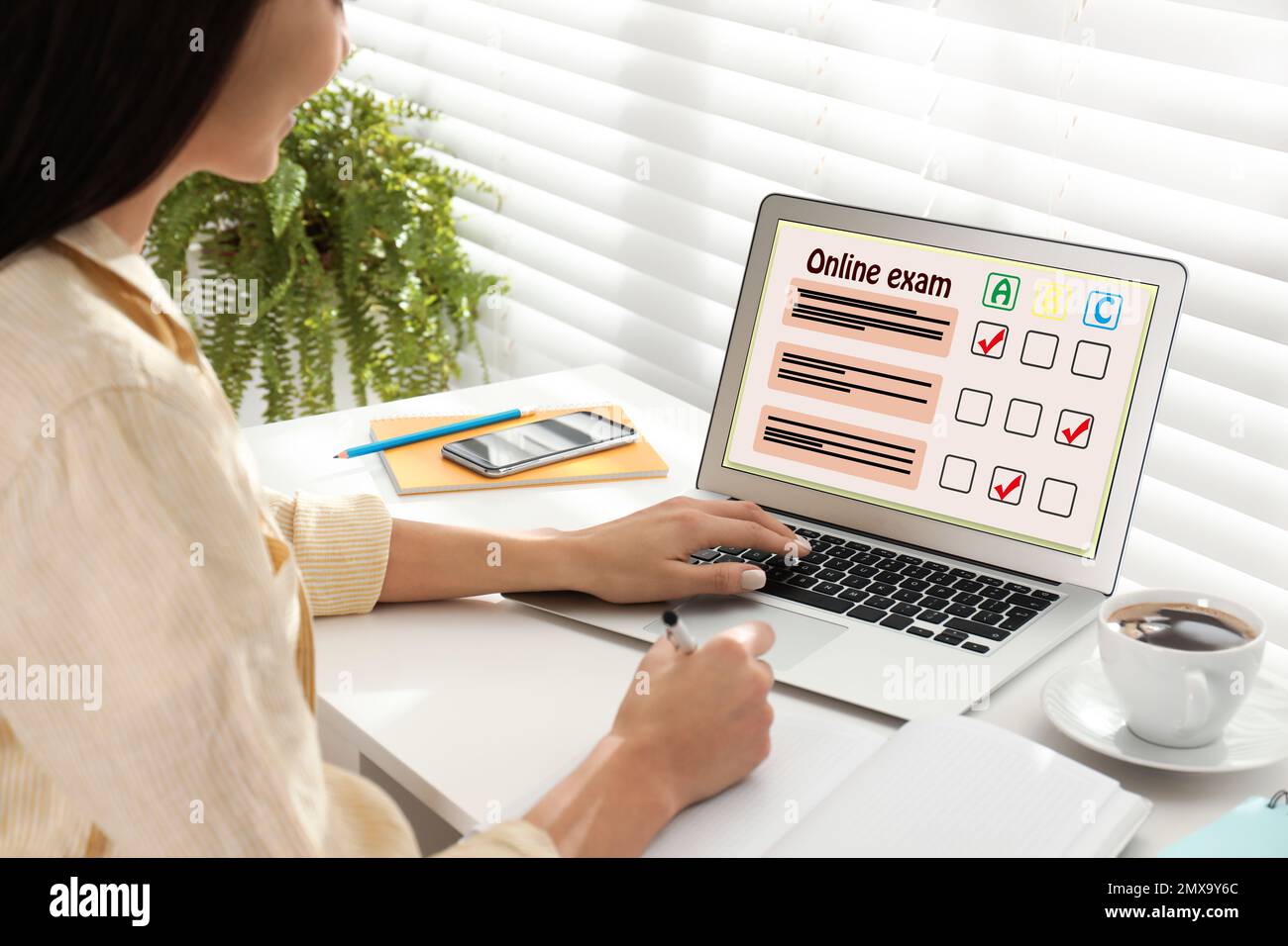 Student passing online exam at home, closeup Stock Photo - Alamy