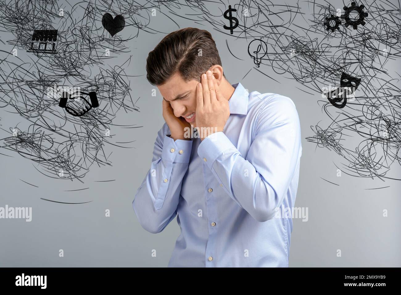 Stressed man with mess in his head on grey background Stock Photo - Alamy