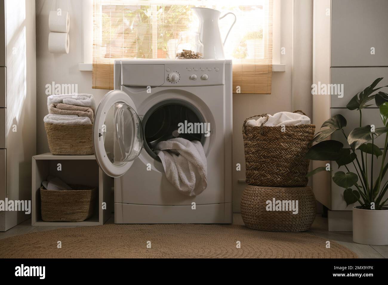Stylish room interior with washing machine. Design idea Stock Photo - Alamy