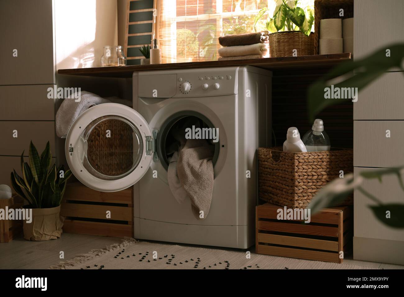 Stylish room interior with washing machine. Design idea Stock Photo - Alamy