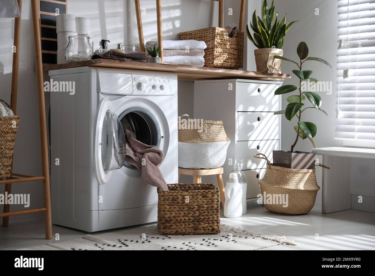 Stylish bathroom interior with modern washing machine Stock Photo - Alamy