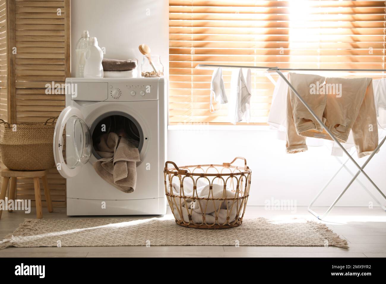 Stylish room interior with washing machine. Design idea Stock Photo - Alamy