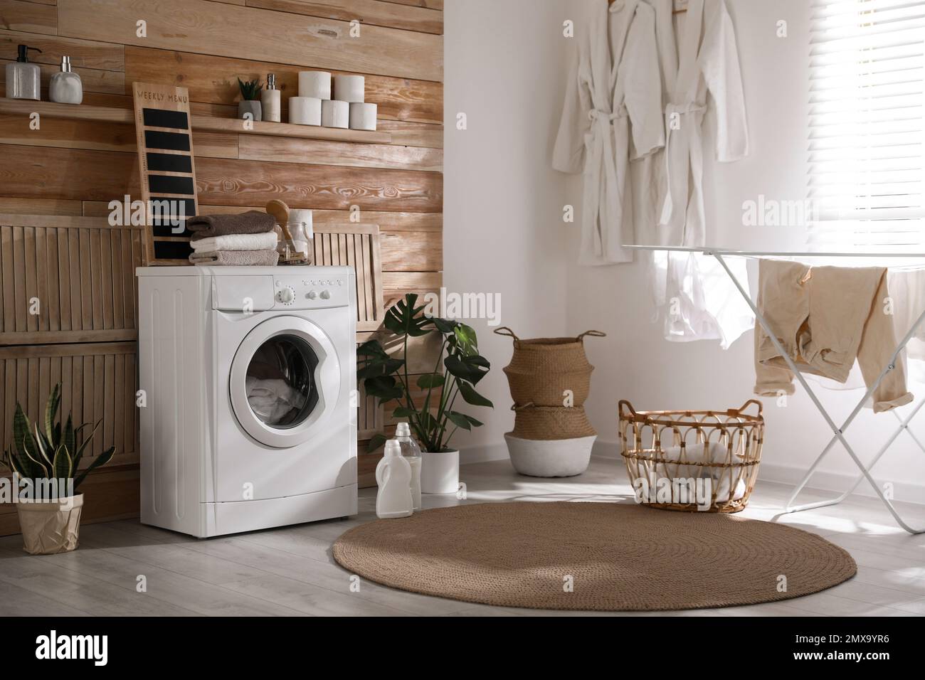 Stylish room interior with washing machine. Design idea Stock Photo - Alamy