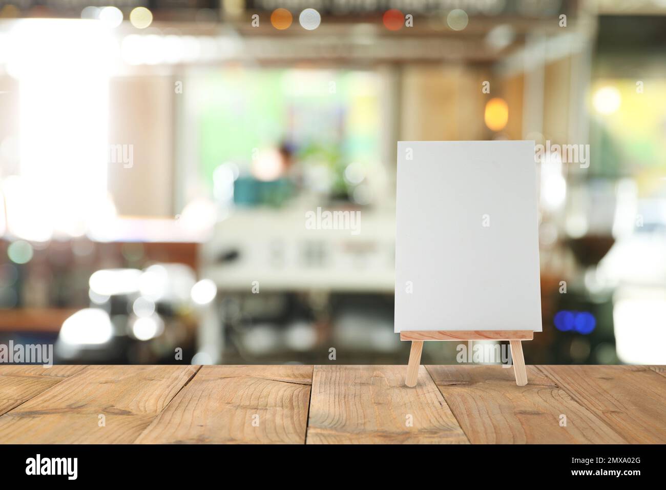 Blank small board on wooden table in cafe, mockup for menu design Stock ...