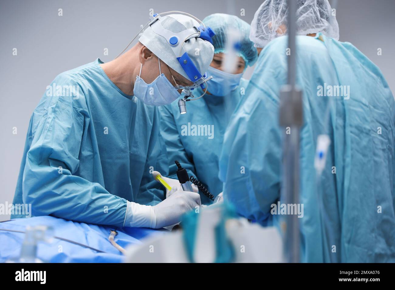 Team of professional doctors performing operation in surgery room Stock ...