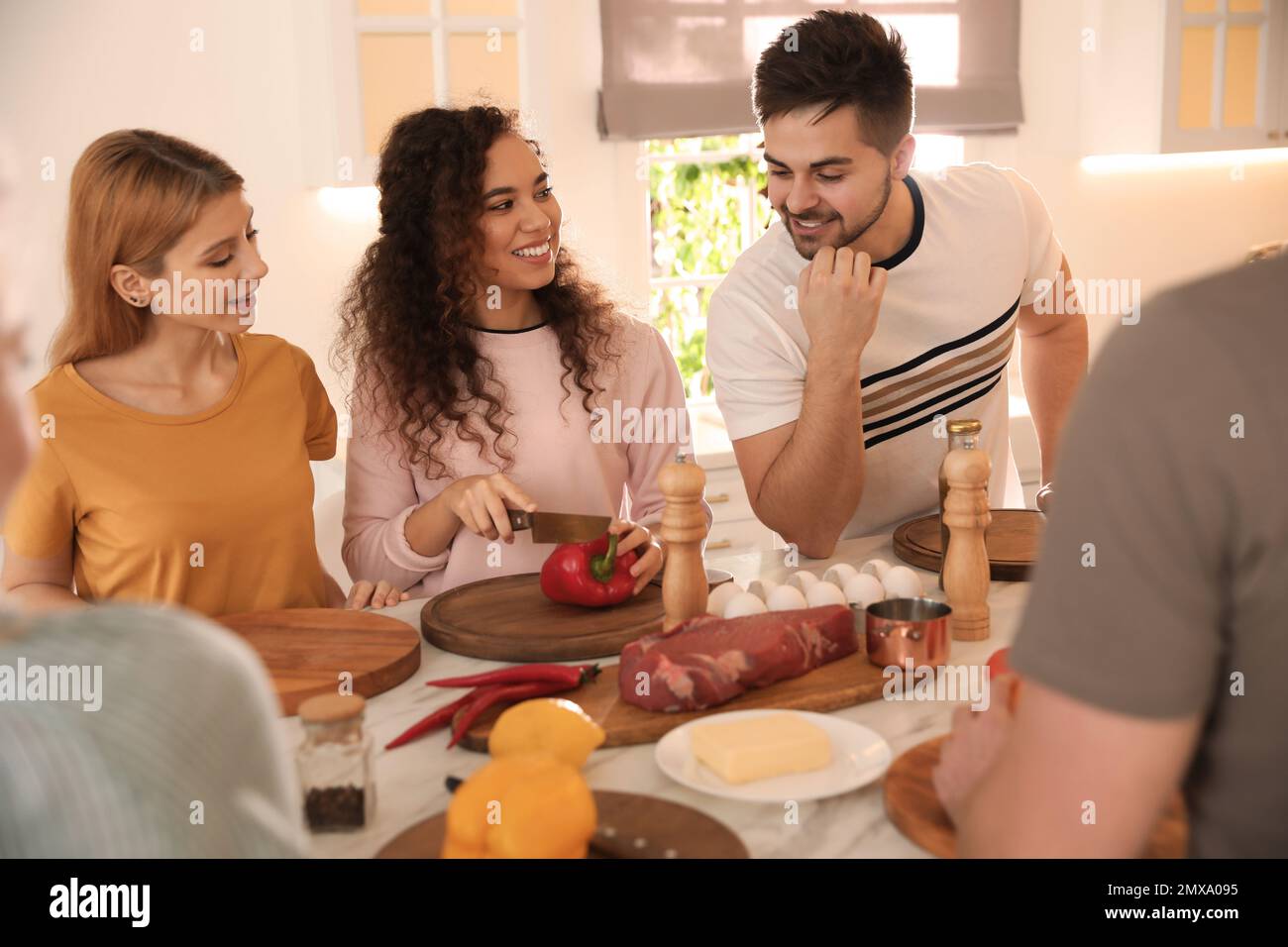 Happy people cooking food together in kitchen Stock Photo - Alamy