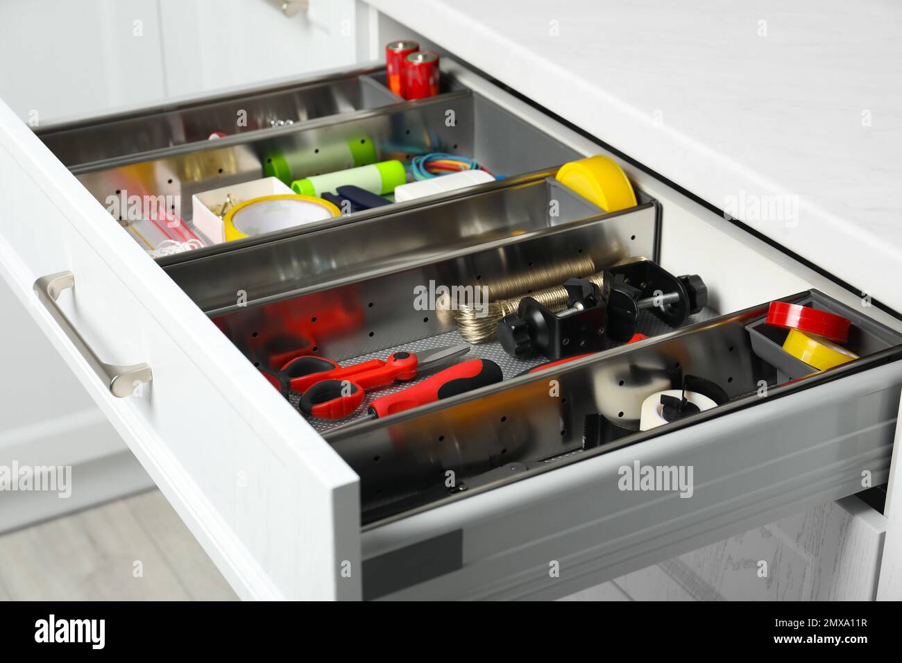 Set of instruments in open desk drawer indoors Stock Photo - Alamy