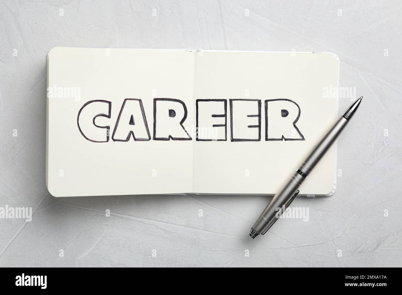 Notebook with word CAREER and pen on white table, top view Stock Photo ...