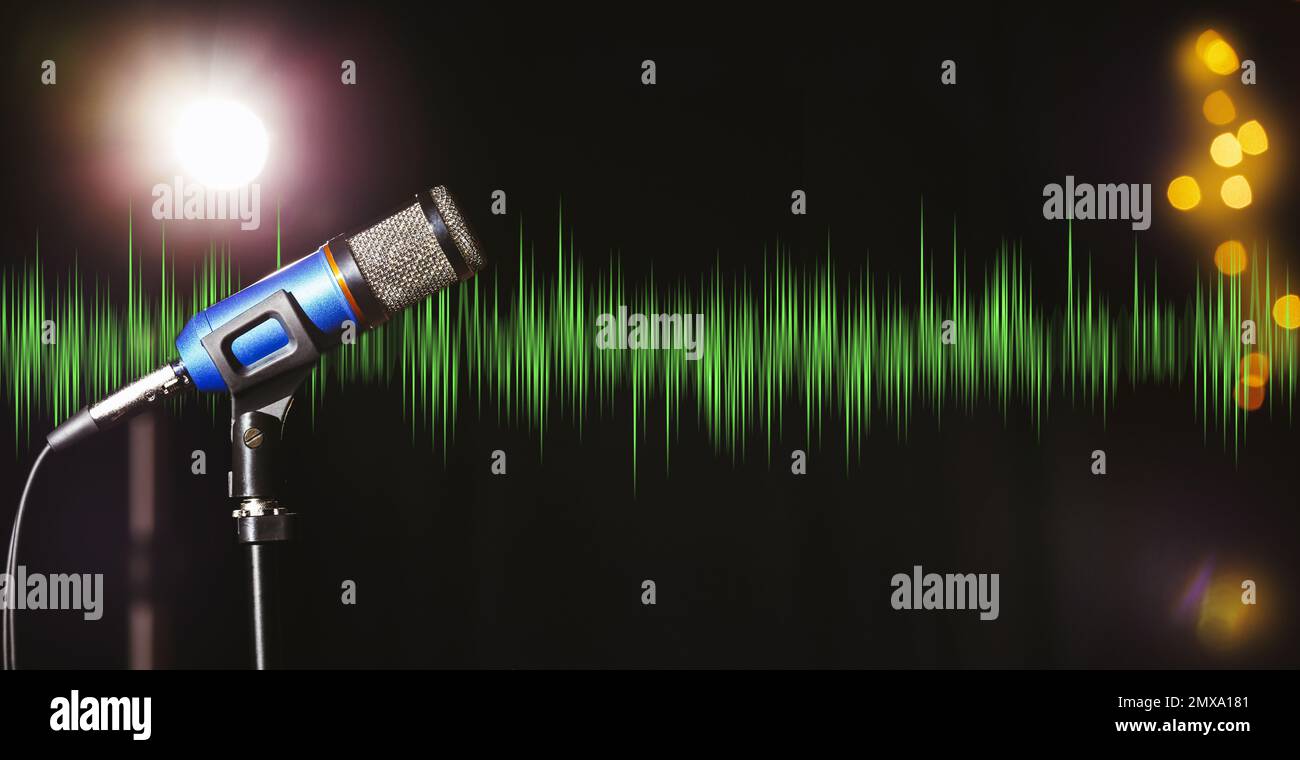 Microphone and radio wave on dark background, bokeh effect. Banner design Stock Photo - Alamy
