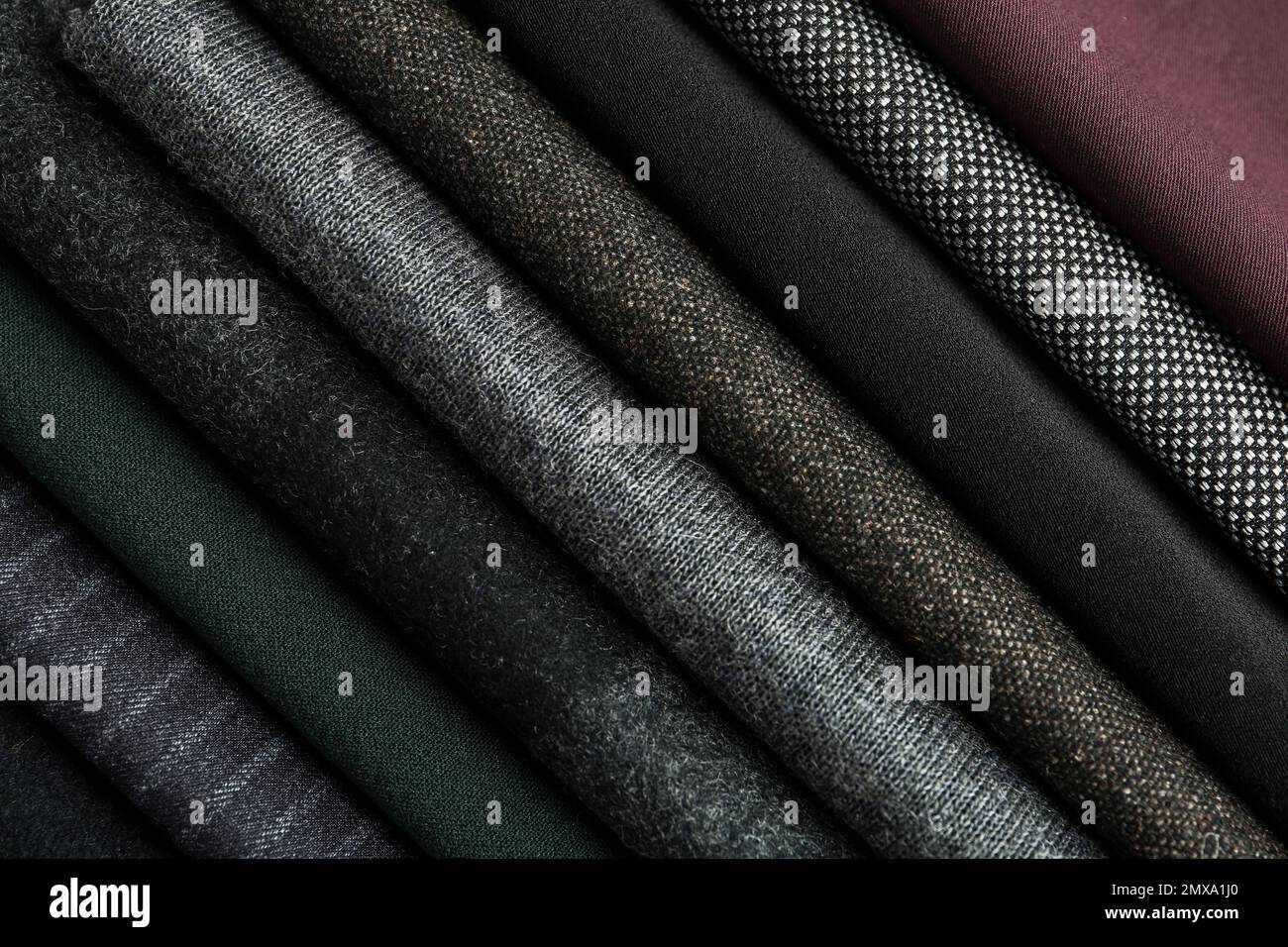 Stack of different fabric samples as background, closeup. Textile ...