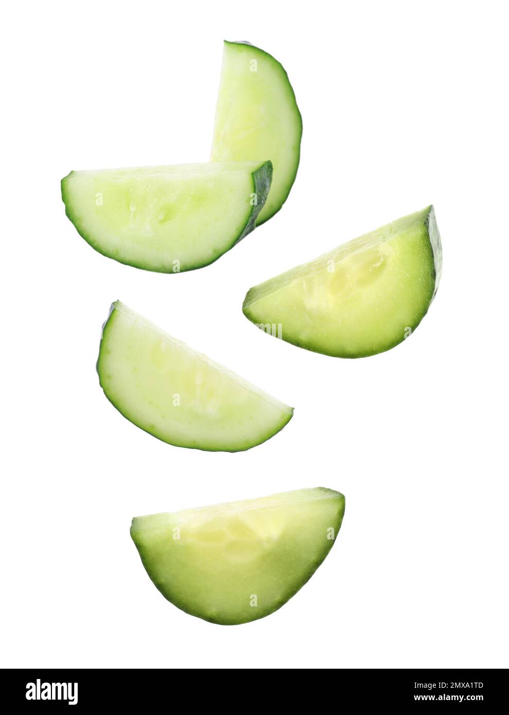 Set of flying fresh cucumber slices on white background Stock Photo - Alamy