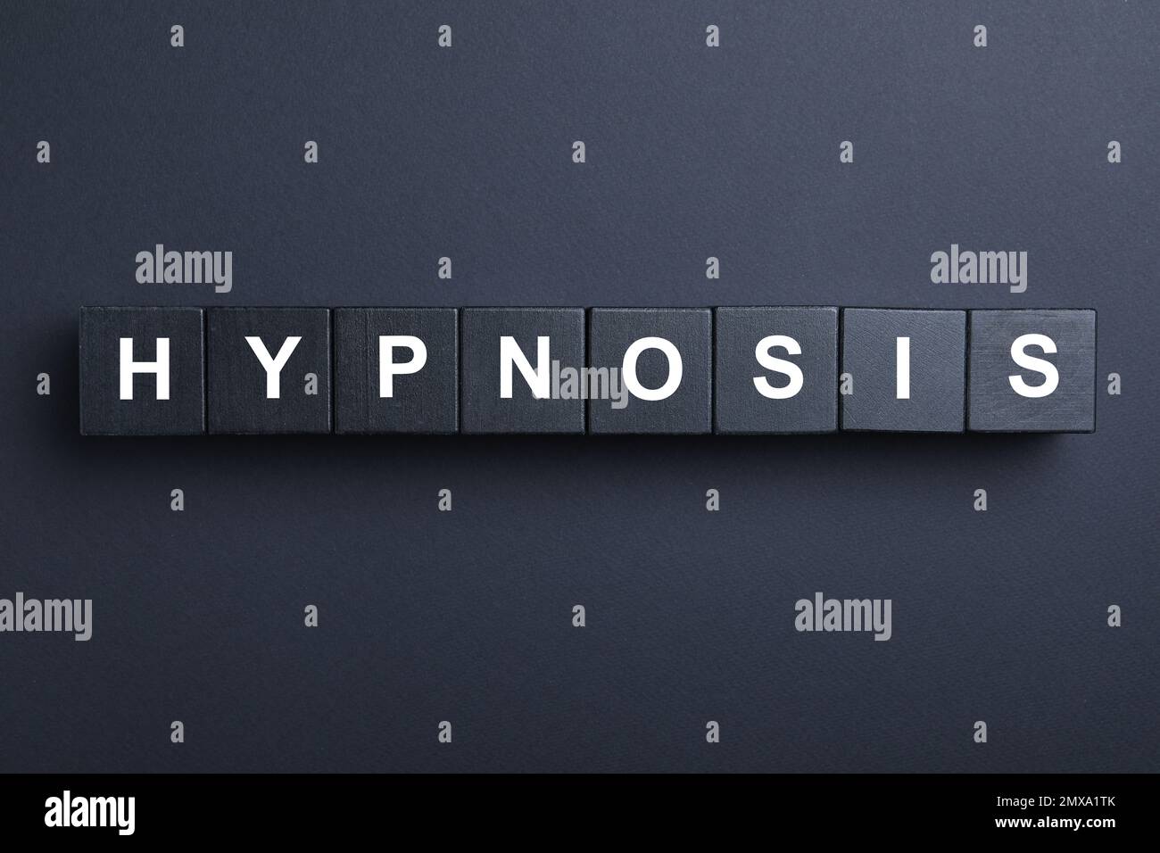 Wooden blocks with word HYPNOSIS on black background, flat lay Stock ...