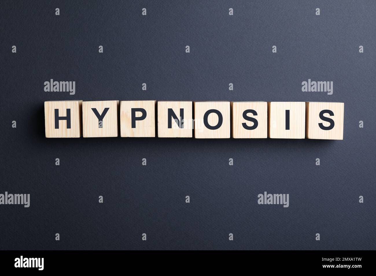 Wooden blocks with word HYPNOSIS on black background, flat lay Stock ...