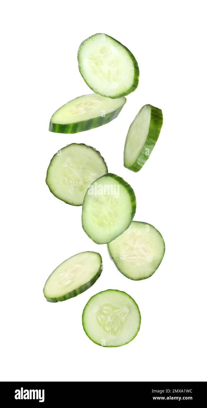 Set of flying fresh cucumber slices on white background Stock Photo - Alamy
