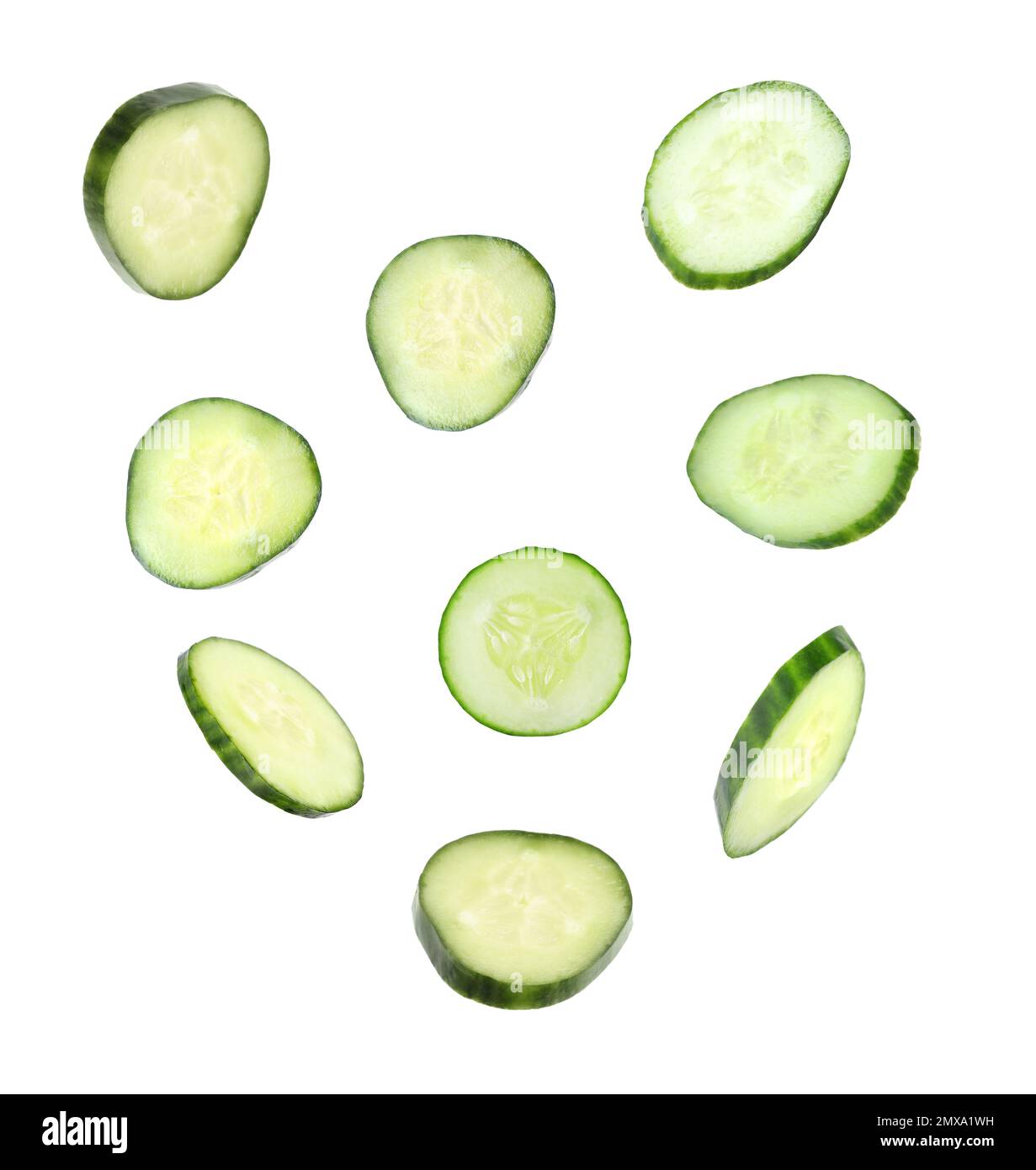 Set of flying fresh cucumber slices on white background Stock Photo - Alamy
