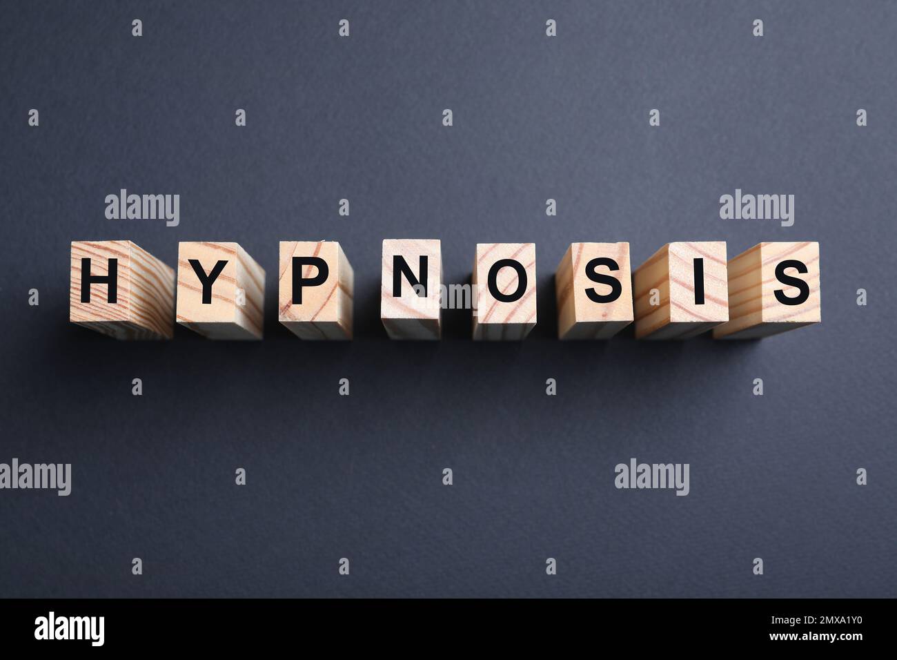 Wooden blocks with word HYPNOSIS on black background, flat lay Stock ...