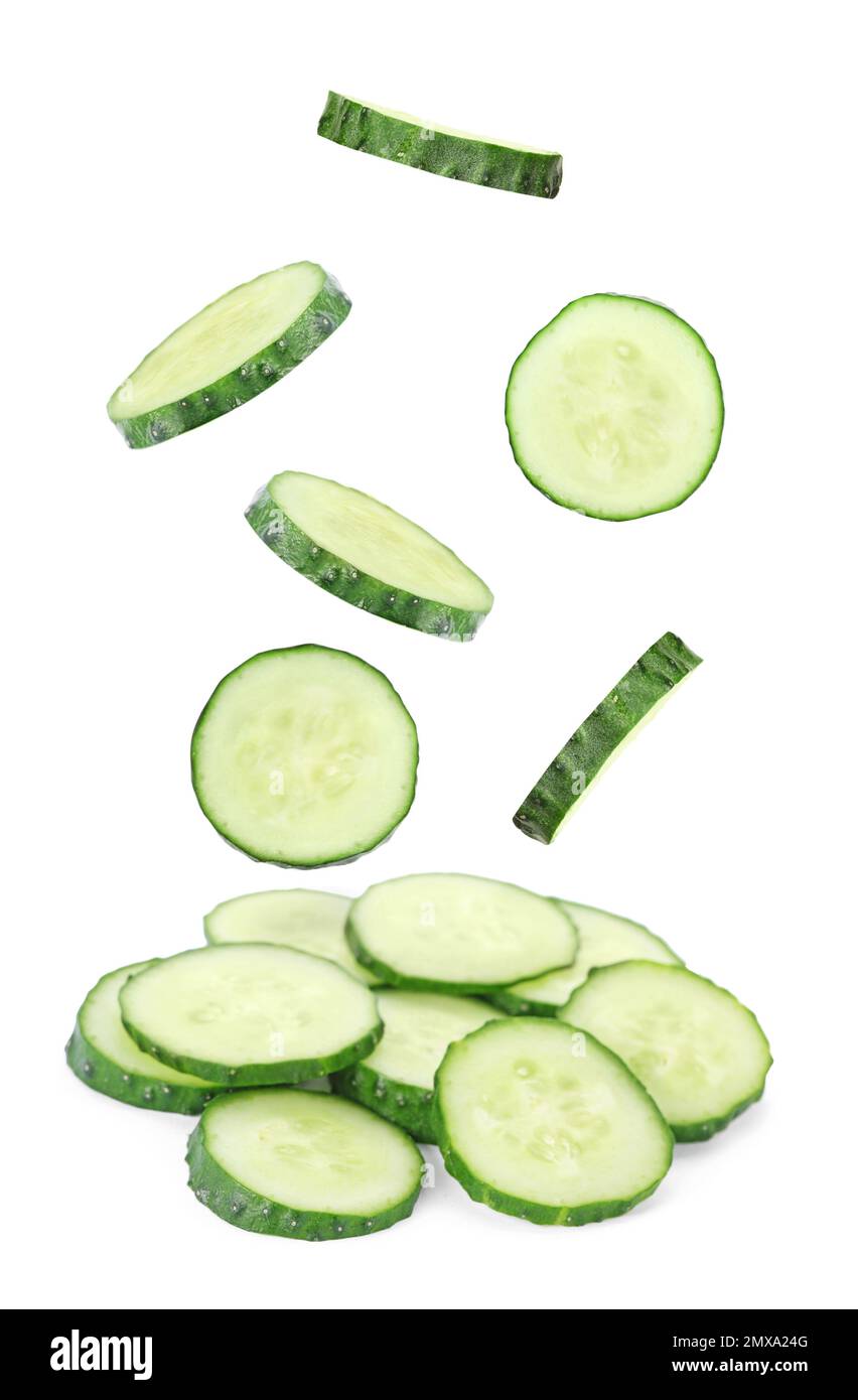 Set of flying fresh cucumber slices on white background Stock Photo - Alamy