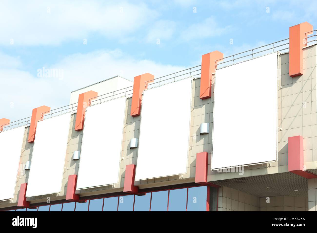 Blank banners on facade of shopping mall. Advertising board design ...