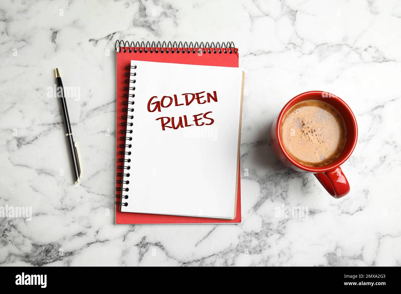 Flat lay composition of notebook with phrase GOLDEN RULES and coffee on ...