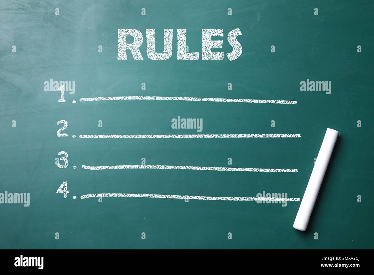 White chalk stick on greenboard and list of rules, top view Stock Photo ...