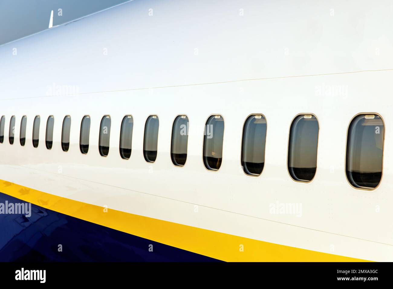 A row of airplane windows, portholes. Outside view Stock Photo - Alamy