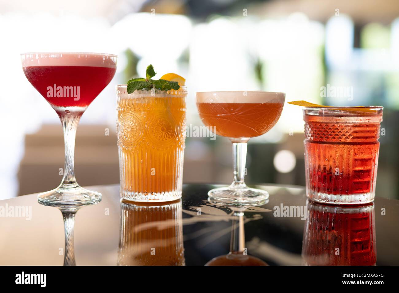 beautiful and delicious alcoholic cocktails prepared at the bar by the ...