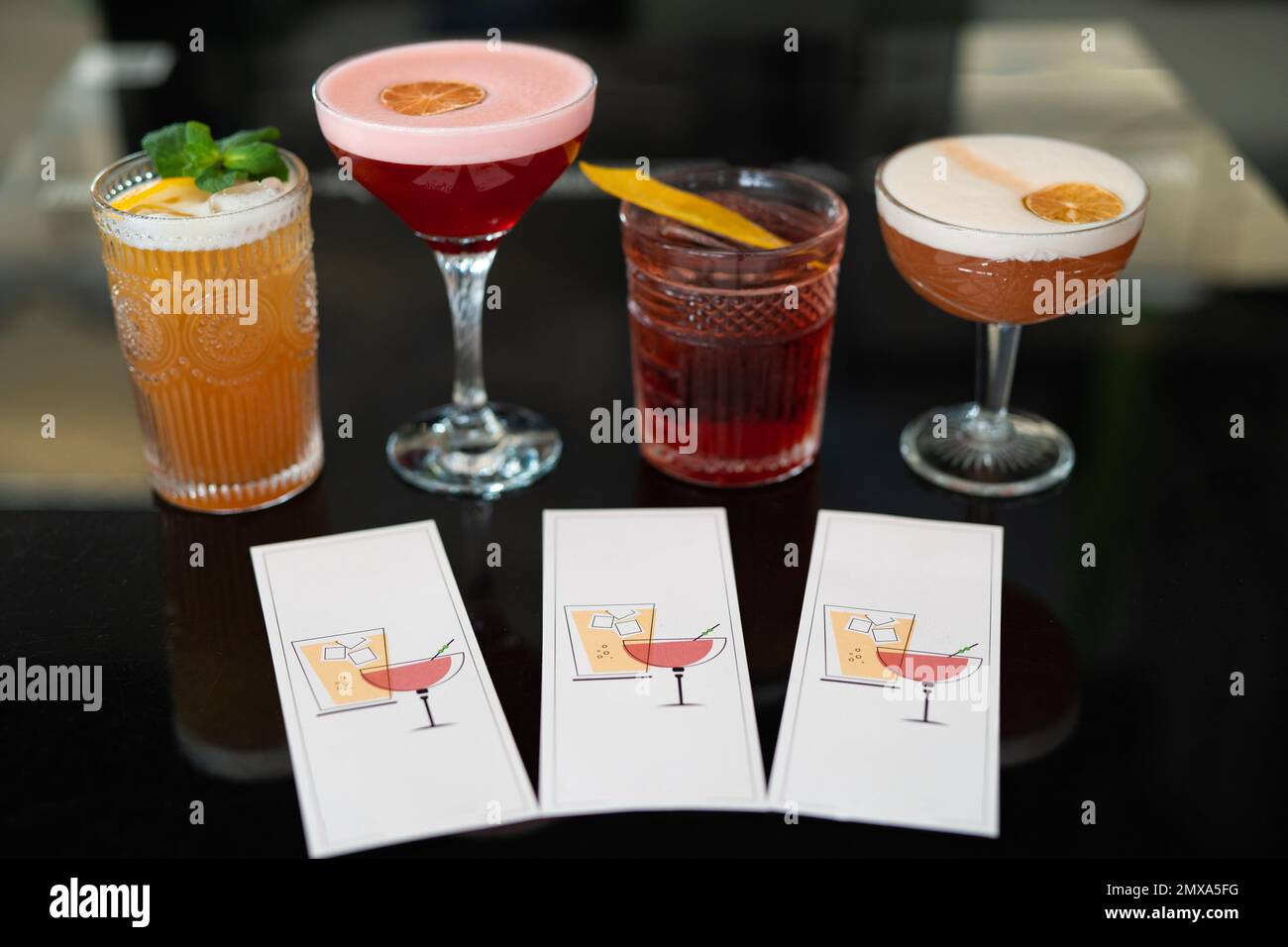 beautiful and delicious alcoholic cocktails prepared at the bar by the ...