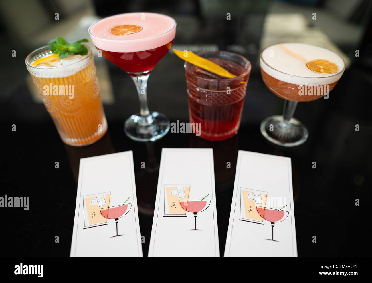 beautiful and delicious alcoholic cocktails prepared at the bar by the ...