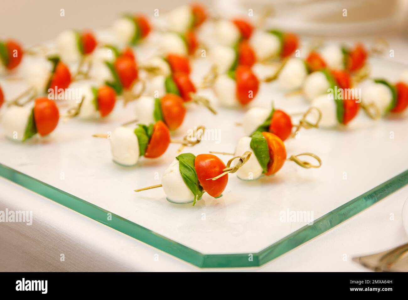 Breakfast in the hotel. Canape with cherry tomatoes Stock Photo - Alamy