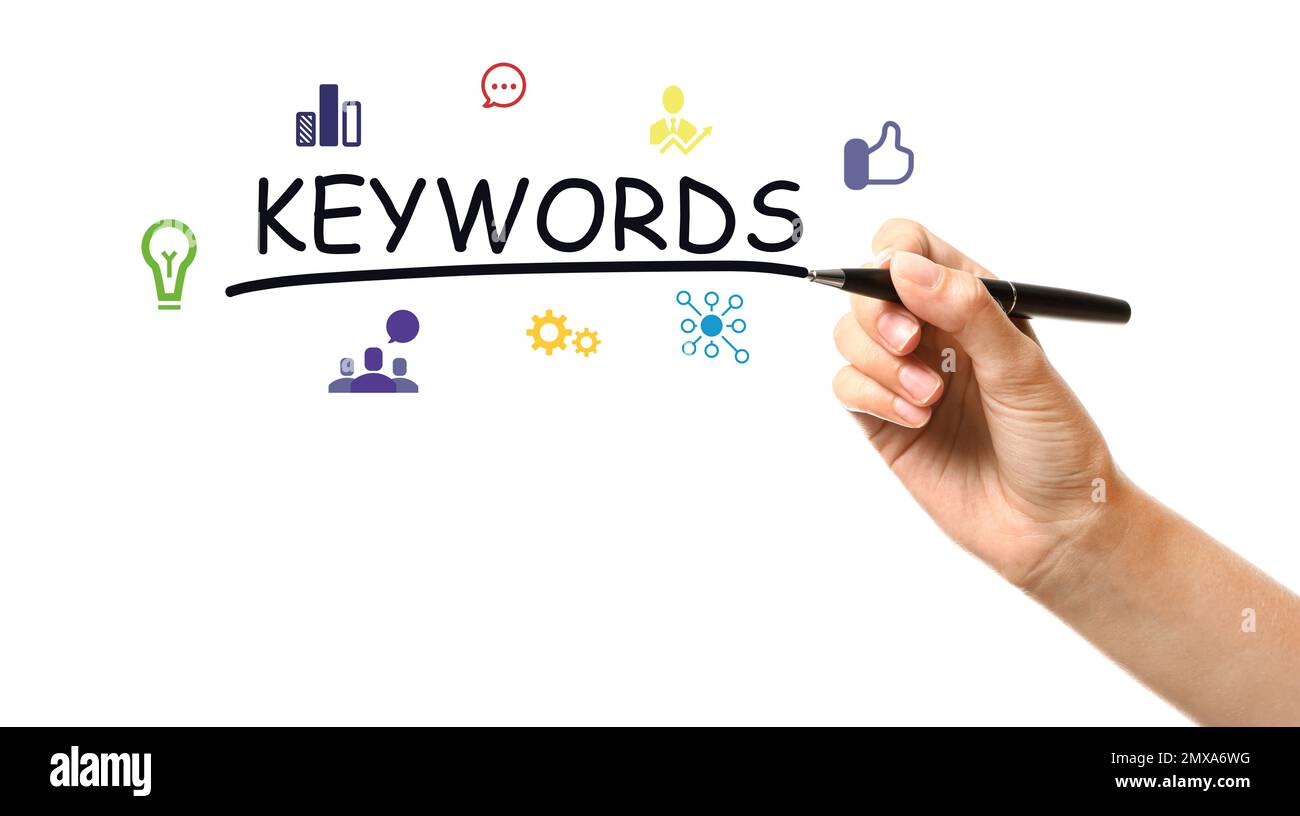 Woman writing word KEYWORDS on transparent board against white ...