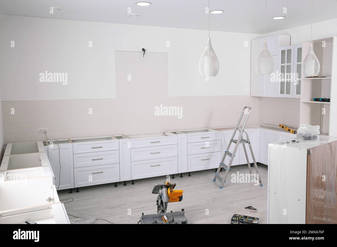 Stylish kitchen interior with newly installed furniture Stock Photo - Alamy