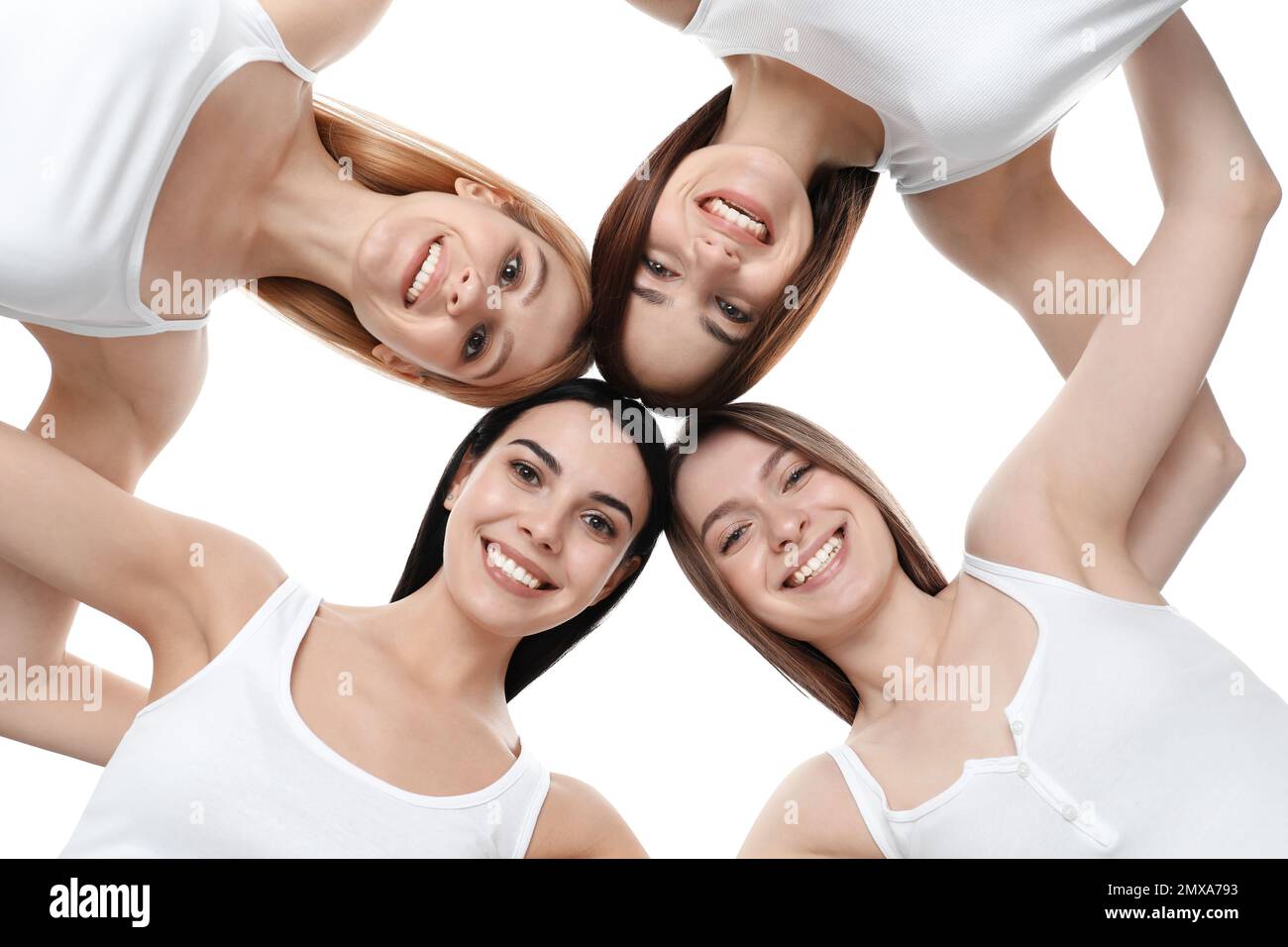 Beautiful young ladies hugging on white background, bottom view. Women ...