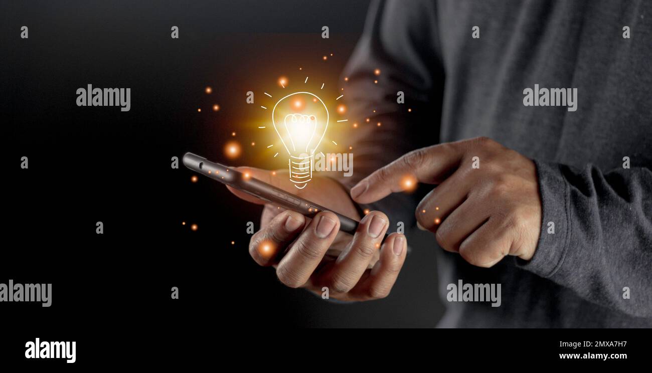 hand holding light bulb. idea concept with innovation and inspiration ...