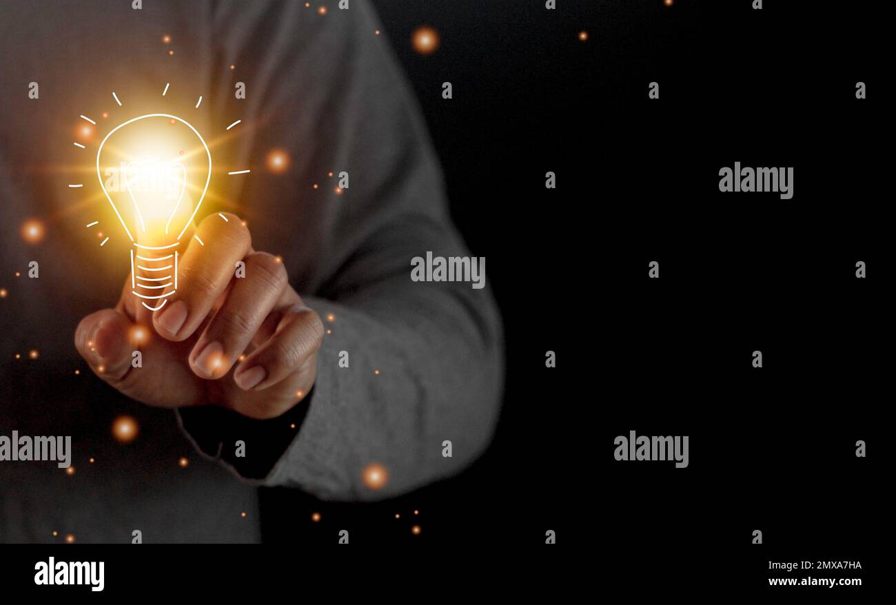 hand holding light bulb. idea concept with innovation and inspiration ...