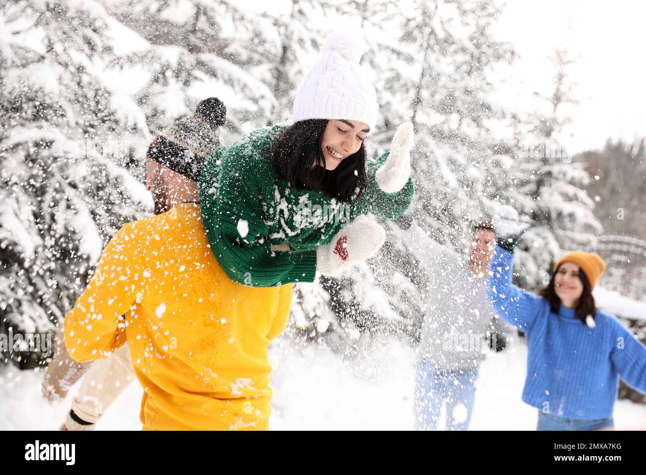 Group friends playing snowballs hi-res stock photography and images - Alamy