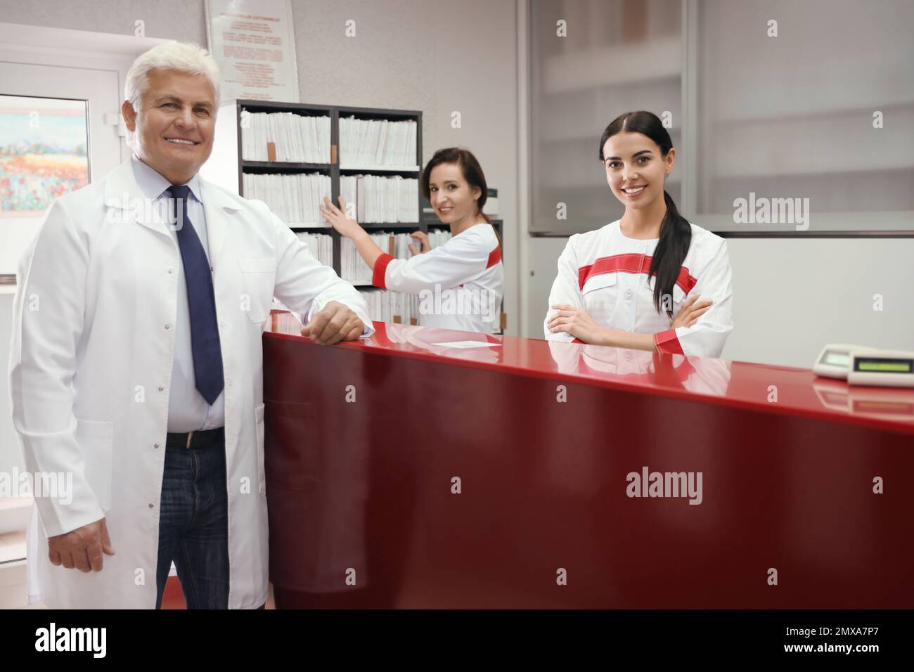 Reception of modern surgery clinic with working staff Stock Photo - Alamy