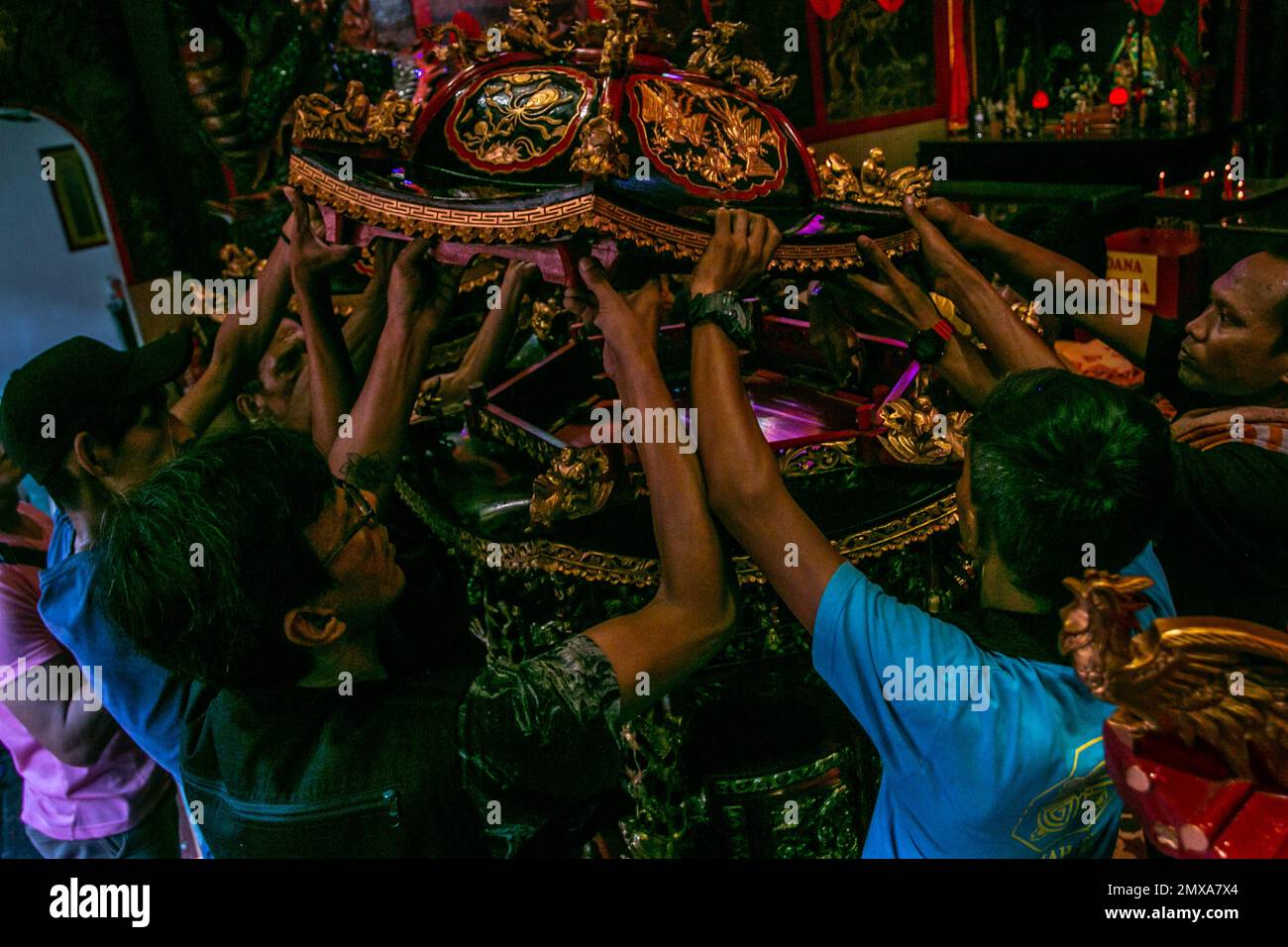 Bogor, Indonesia. 02nd Feb, 2023. Workers temple lift a parts of palanquin for statue of a deity ...